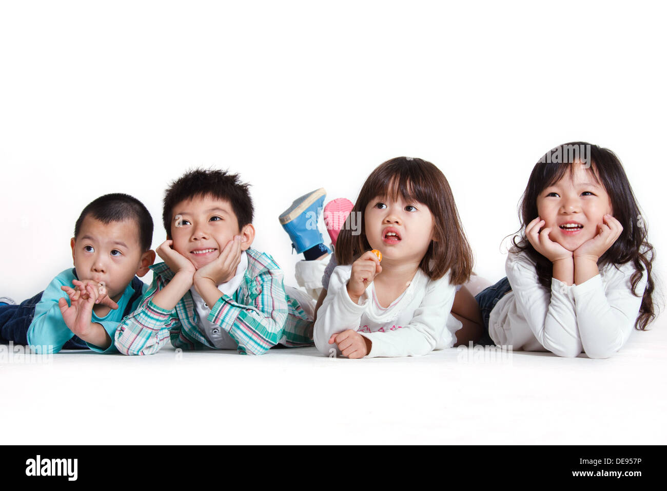 Children lying together Stock Photo - Alamy