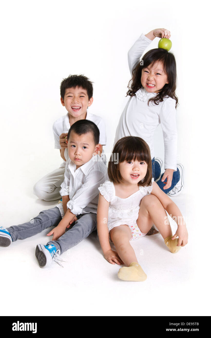 Children sitting together Stock Photo - Alamy
