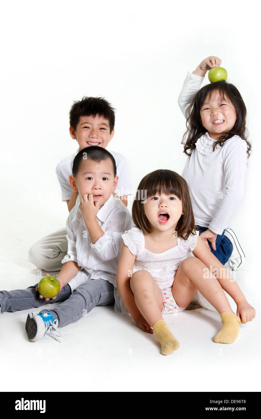 Children sitting together Stock Photo - Alamy
