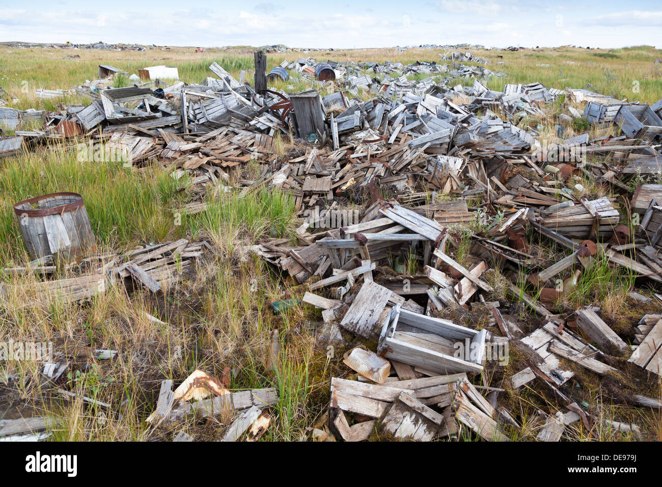 Old broken wooden boxes and trash in a landfill in the tundra Stock ...