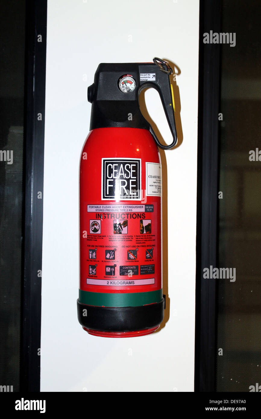 A fire extinguisher mounted on wall Stock Photo - Alamy