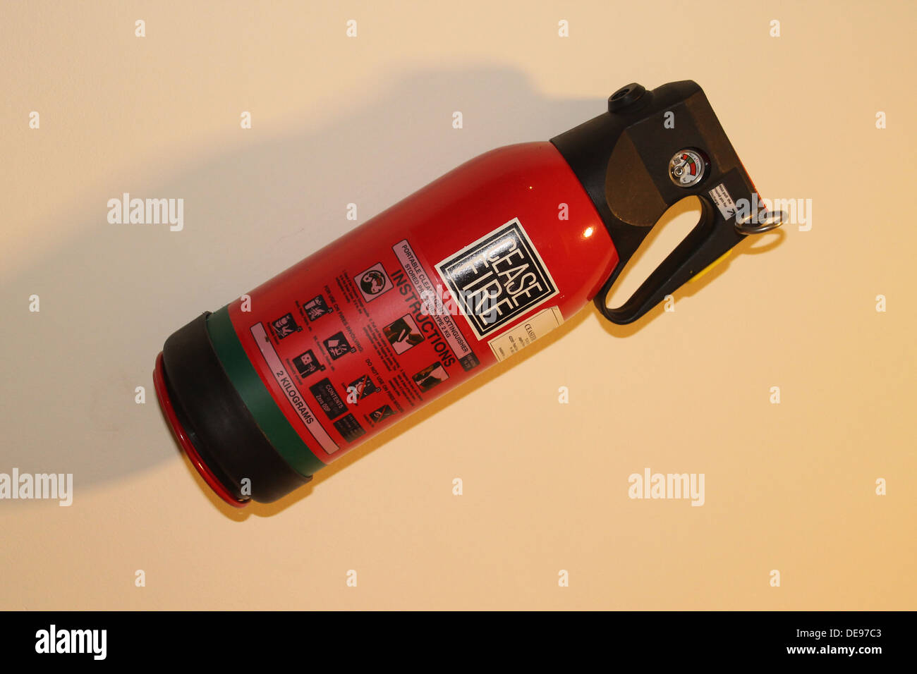 A fire extinguisher mounted on wall Stock Photo - Alamy