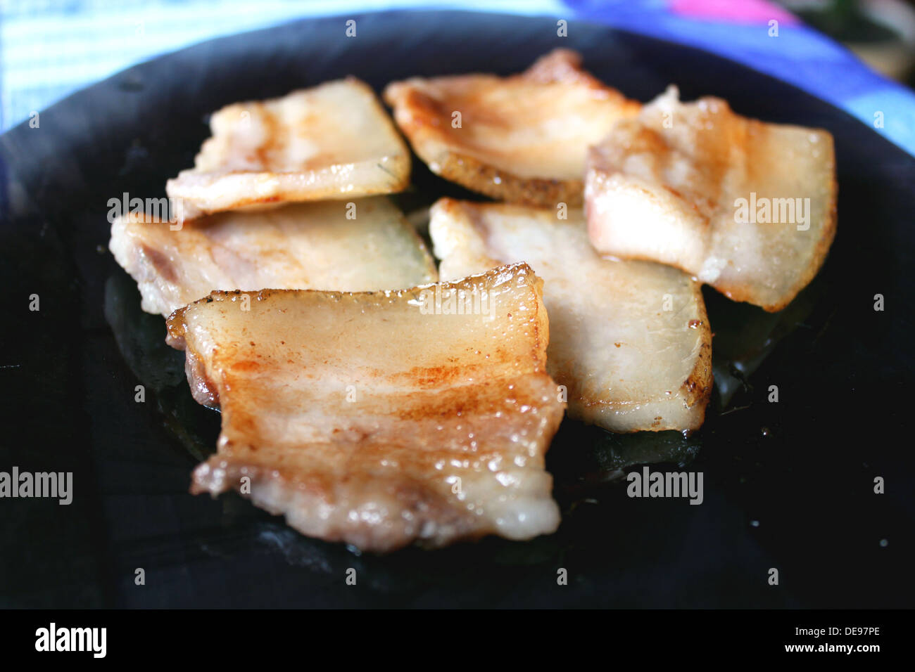 tasty fried pieces of lard on the plate Stock Photo - Alamy