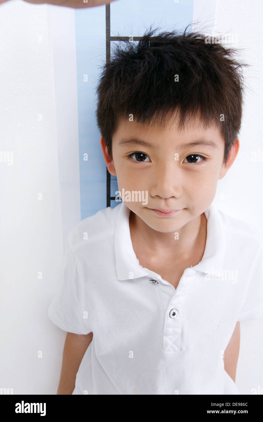 Boy measuring height Stock Photo - Alamy