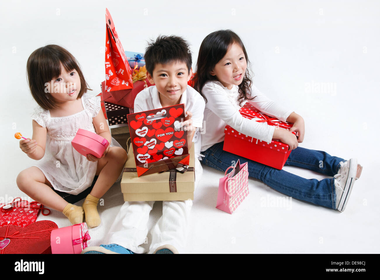 Children with gift boxes Stock Photo - Alamy