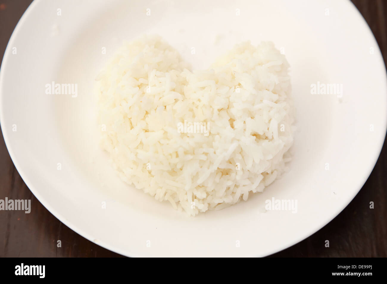 rice heart shape on whiteplate Stock Photo - Alamy