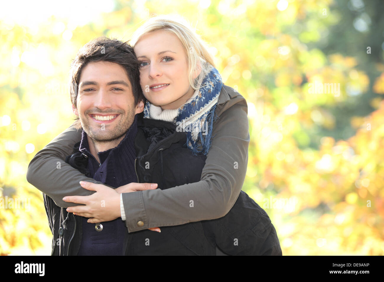 Happy young couple arms wrapped hi-res stock photography and images - Alamy