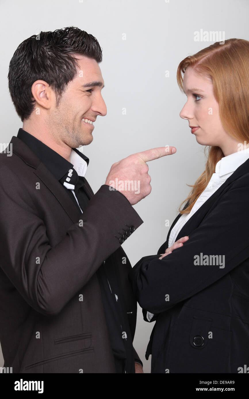 Man making fun of a woman Stock Photo - Alamy
