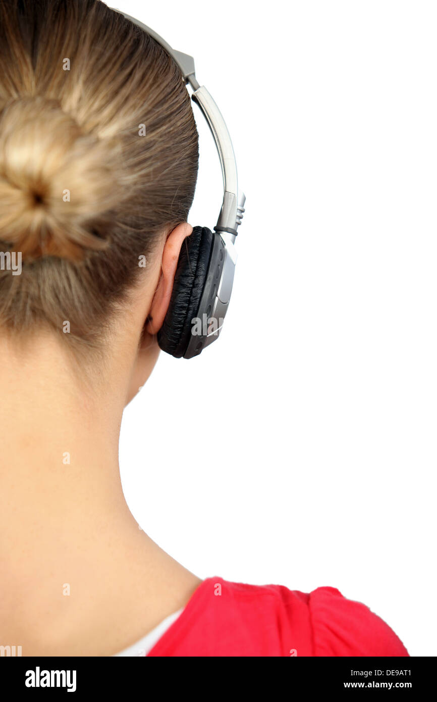Girl listening to music with headphones, back view Stock Photo - Alamy