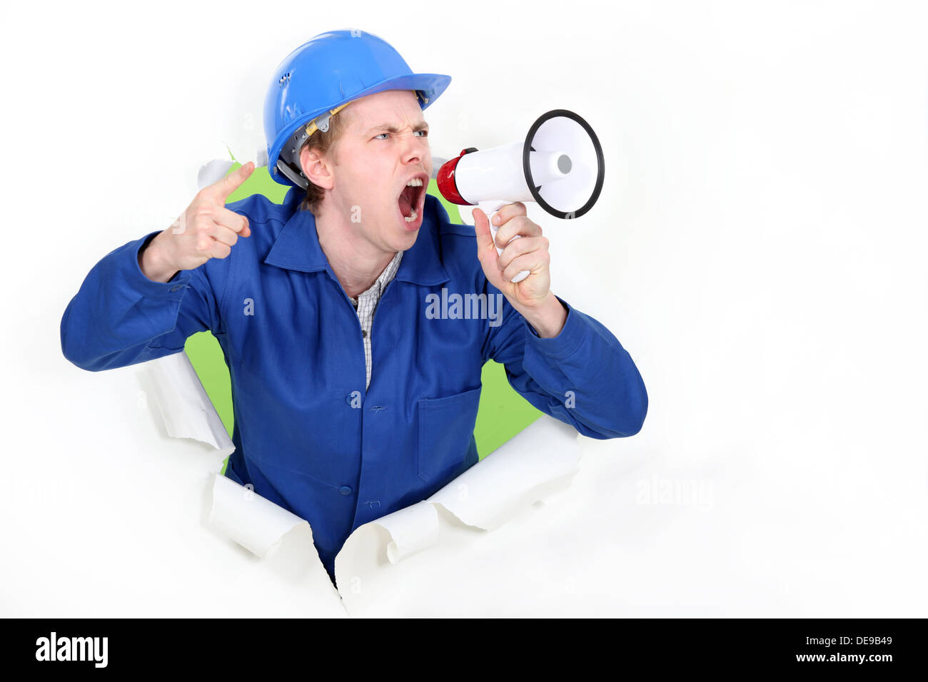 Construction worker with a megaphone Stock Photo - Alamy