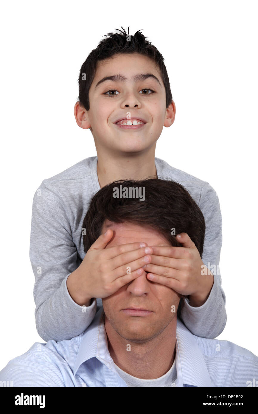child covering father's eyes Stock Photo - Alamy