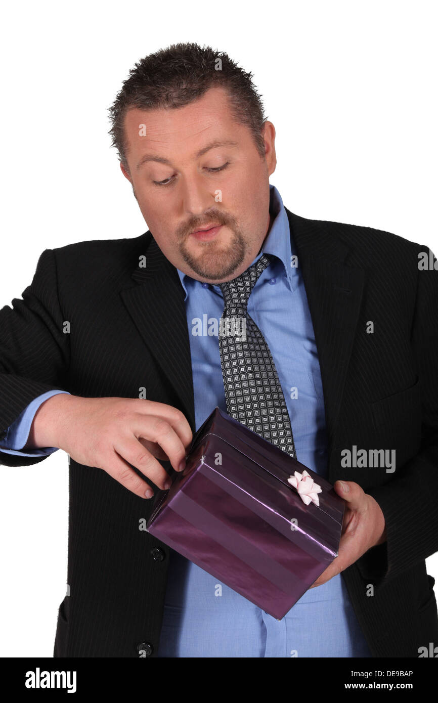 Businessman opening a box hi-res stock photography and images - Alamy