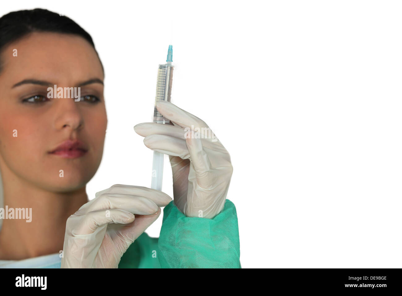 Female nurse holding syringe Stock Photo - Alamy