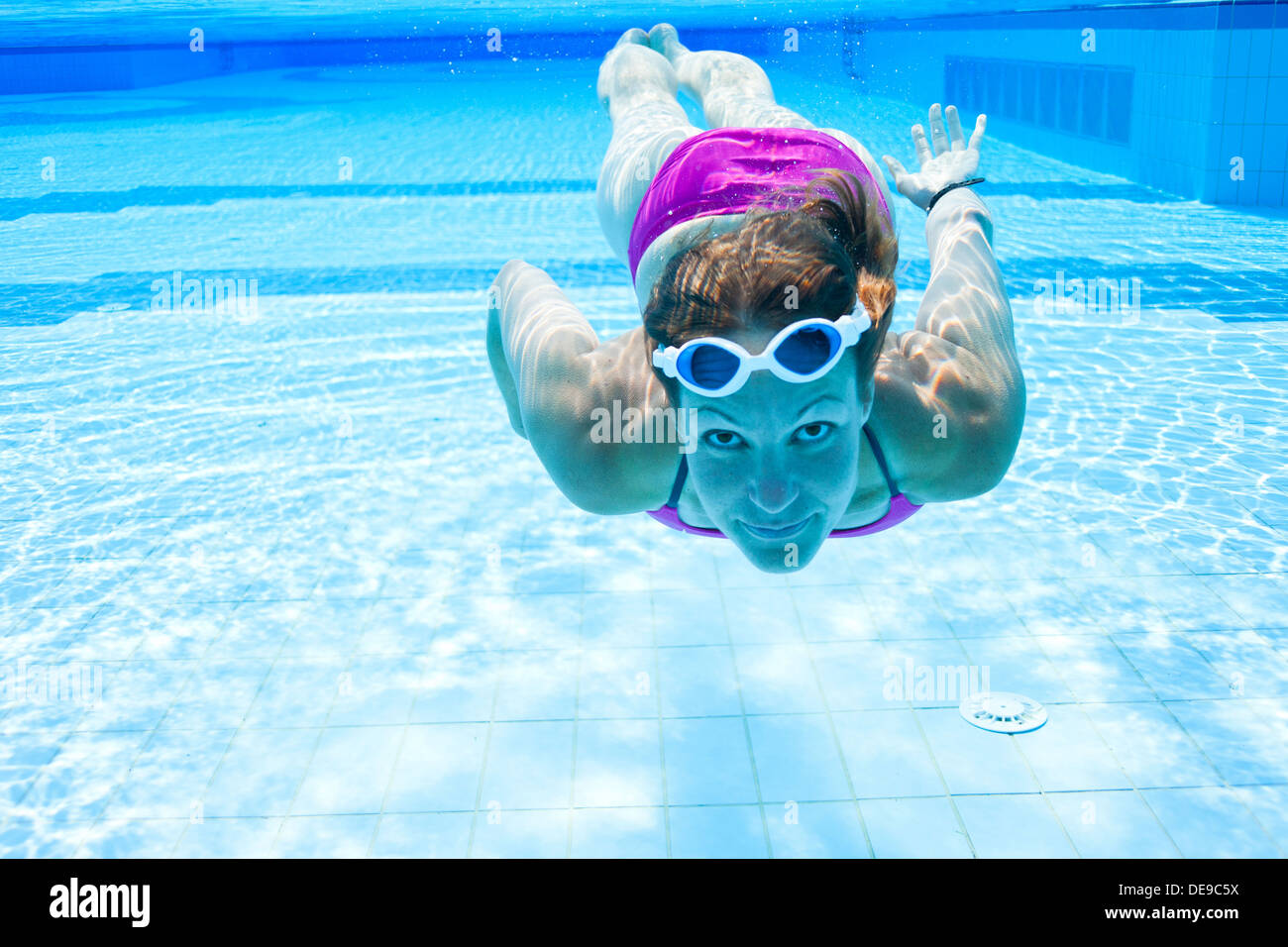 Female swimmer underwater in swimming pool with eyes open Stock Photo ...