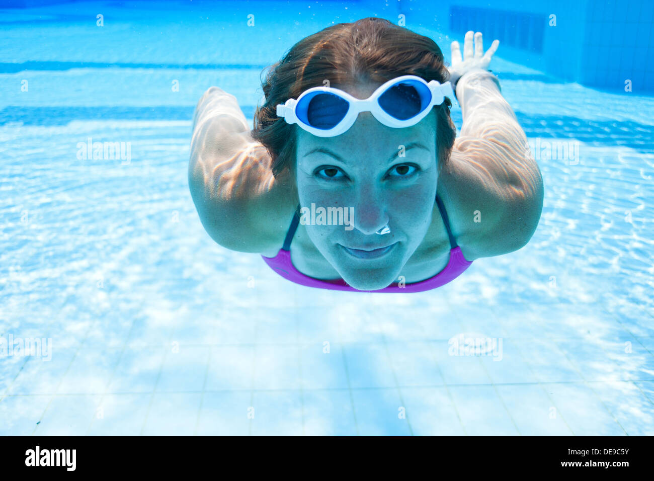Female swimmer underwater in swimming pool with eyes open Stock Photo ...