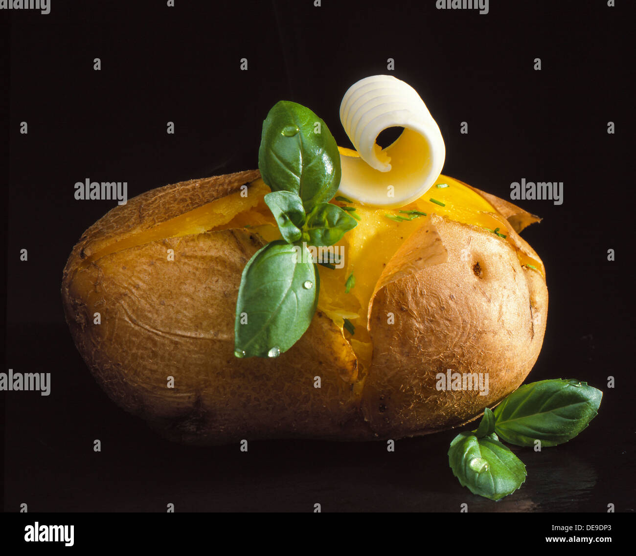 Baked Potato with Butter Stock Photo - Alamy