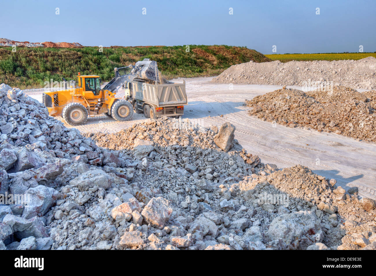 loading a large lorry building material, clay pit Stock Photo - Alamy