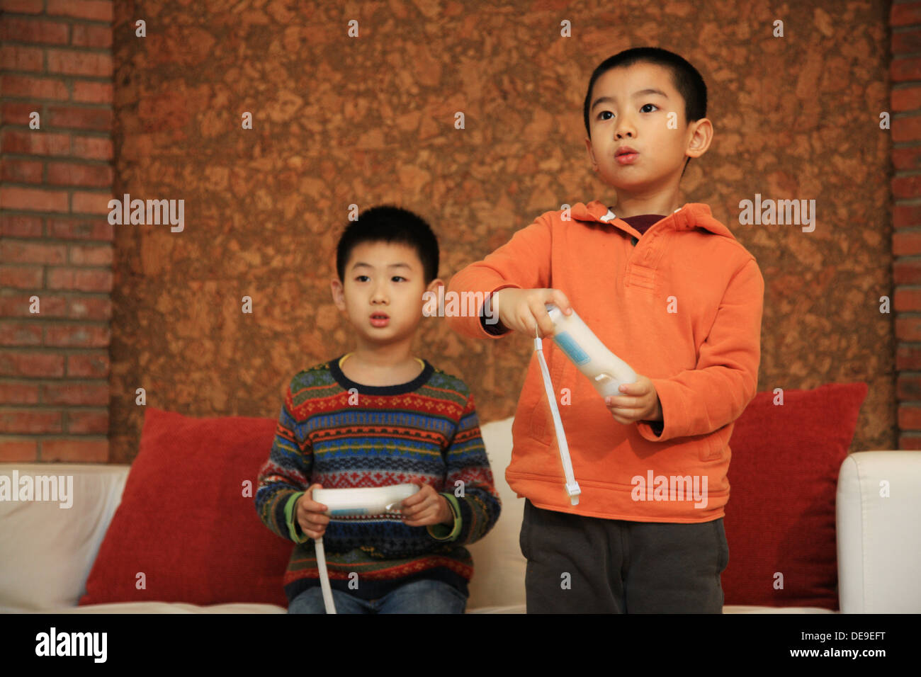 Two boys playing games Stock Photo - Alamy
