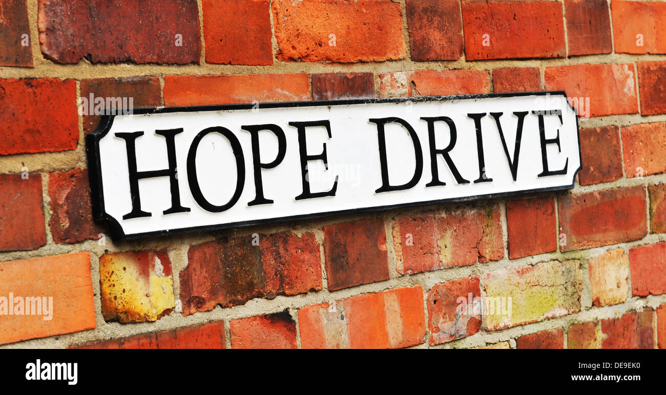 Hope drive sign against old red brick background Stock Photo - Alamy