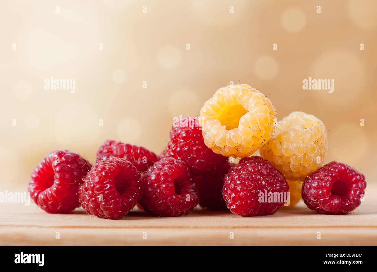 ripe red and golden raspberry fruits in pile Stock Photo - Alamy