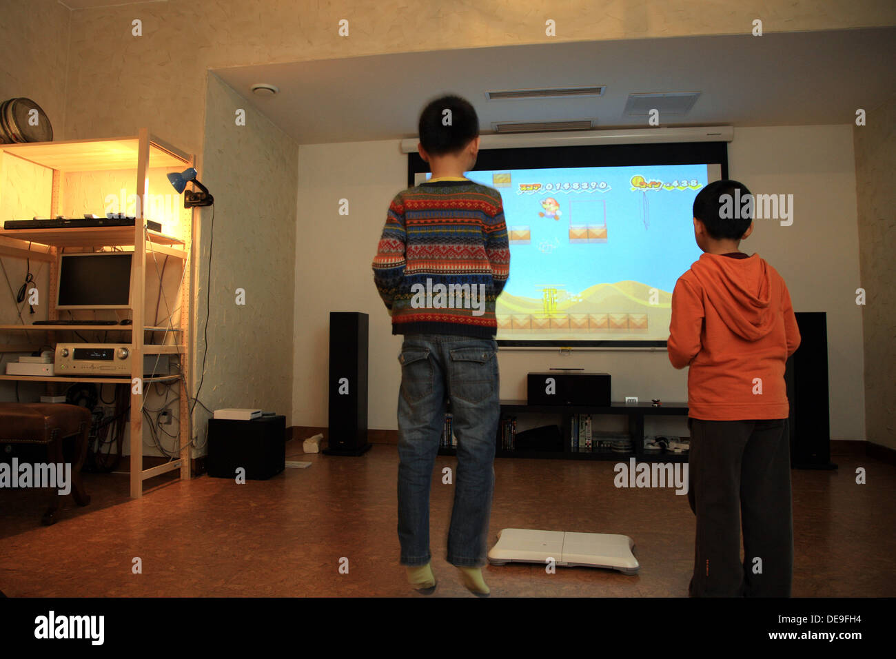 Two boys playing games Stock Photo - Alamy
