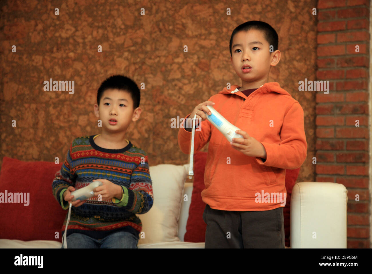 Two boys playing games Stock Photo - Alamy