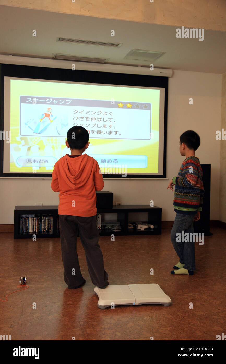 Two boys playing games Stock Photo - Alamy