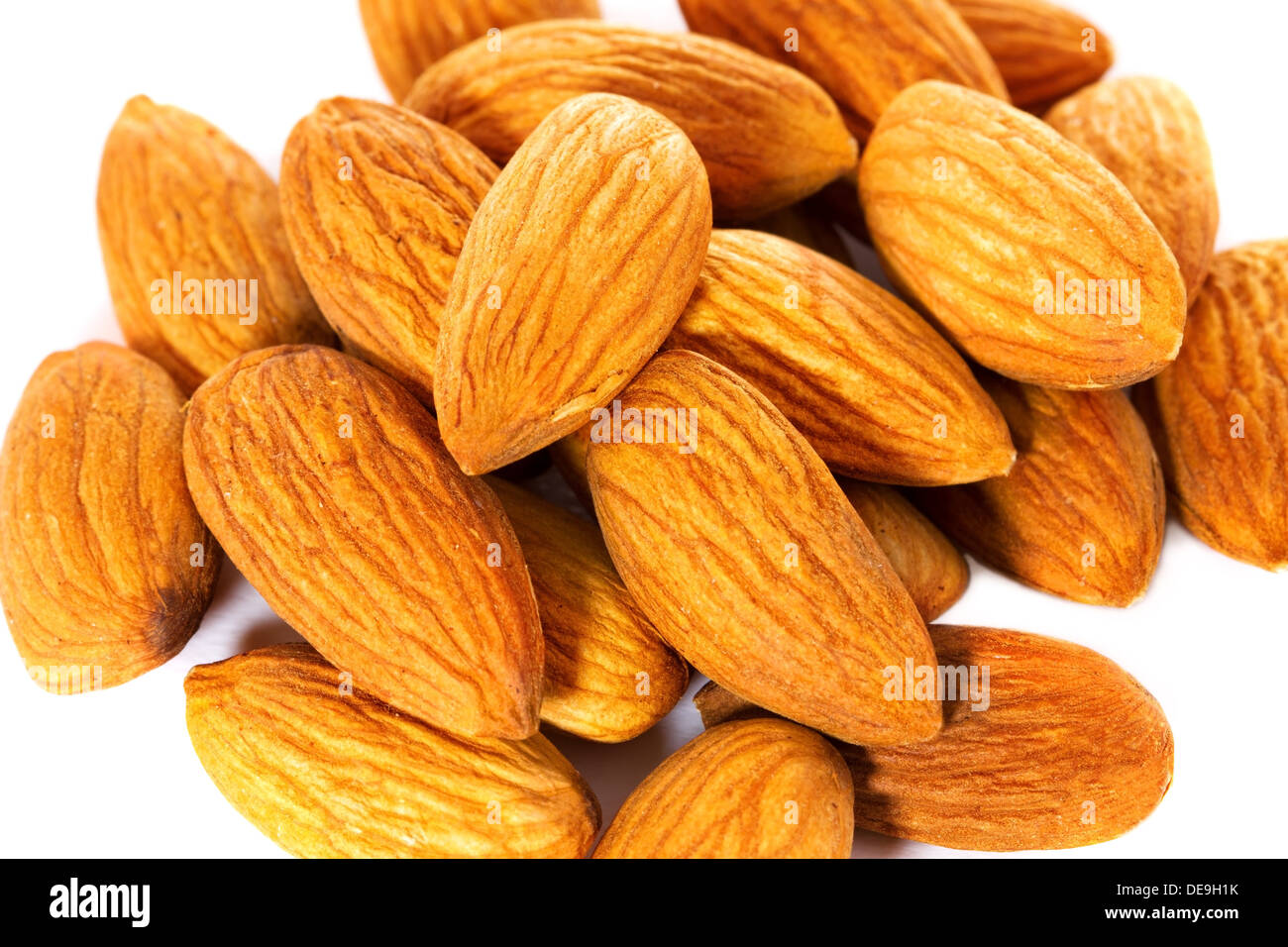 Seed of almonds nuts isolated on white Stock Photo - Alamy