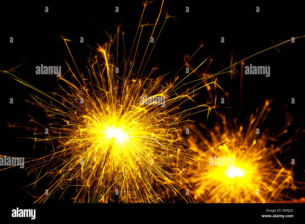 Sparklers shining bright and colourful Stock Photo - Alamy