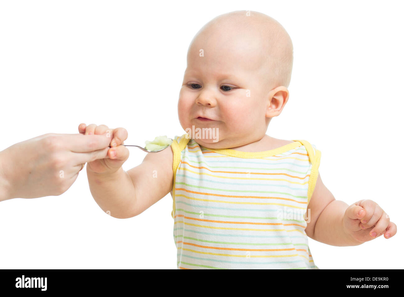 Little baby feeding with a spoon Stock Photo - Alamy