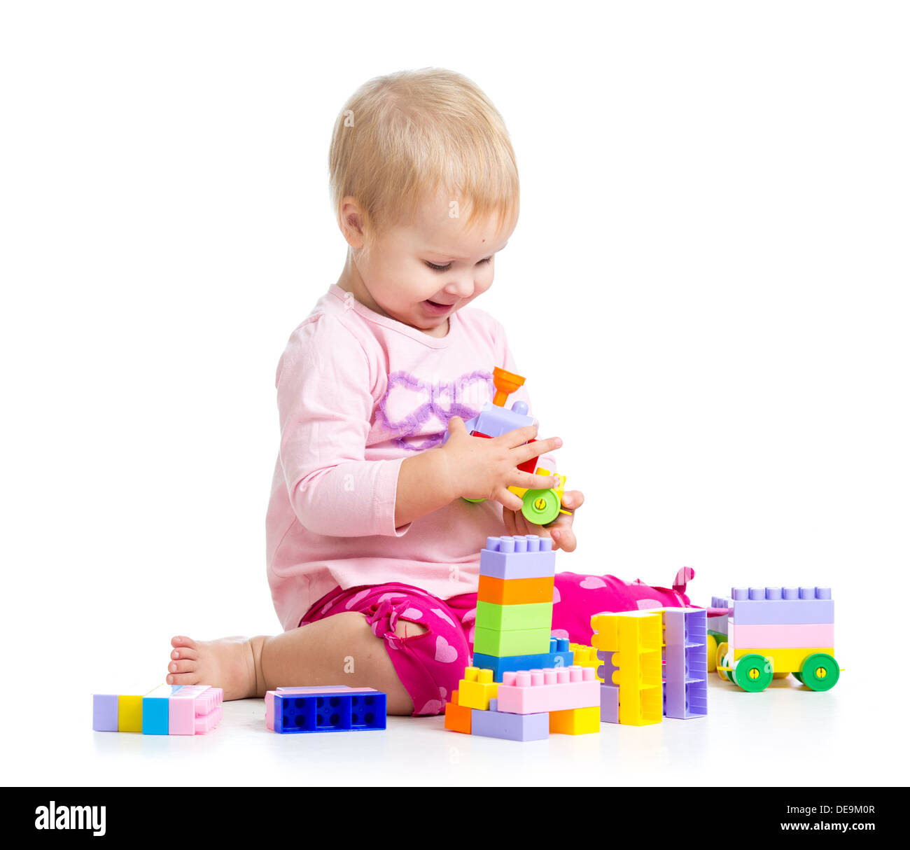 child girl playing with construction set over white background Stock ...