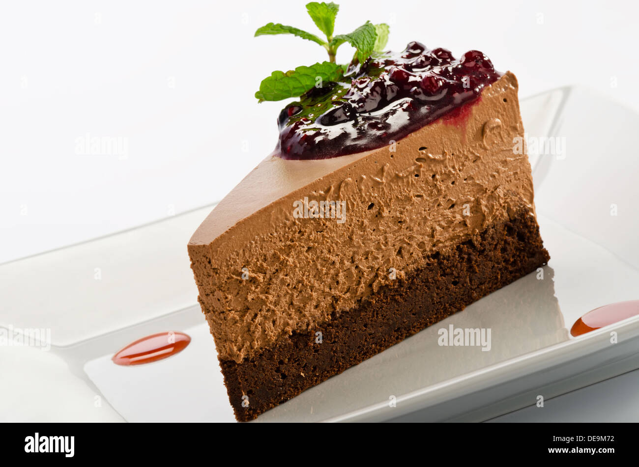 Chocolate layered mousse cake with dark cherries Stock Photo - Alamy