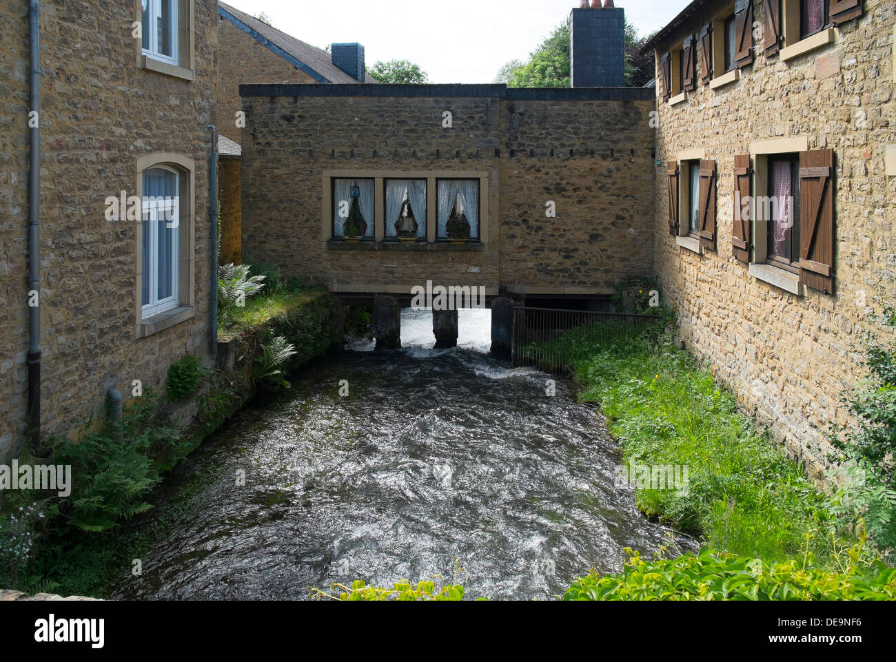 river flowing under house Stock Photo - Alamy