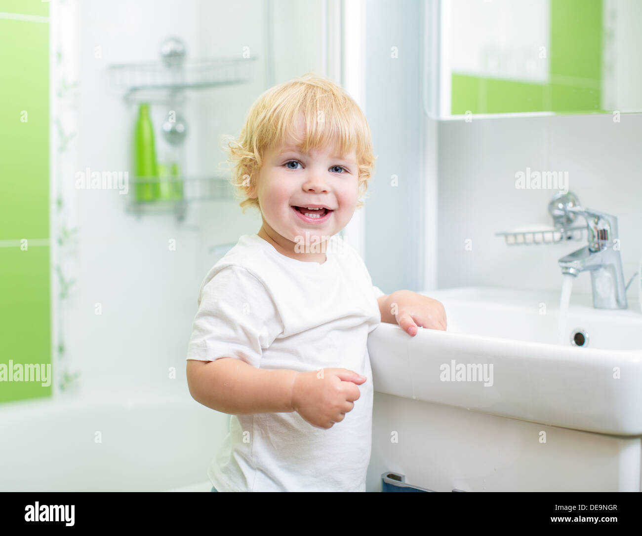 Child washing hands bathroom hi-res stock photography and images - Alamy