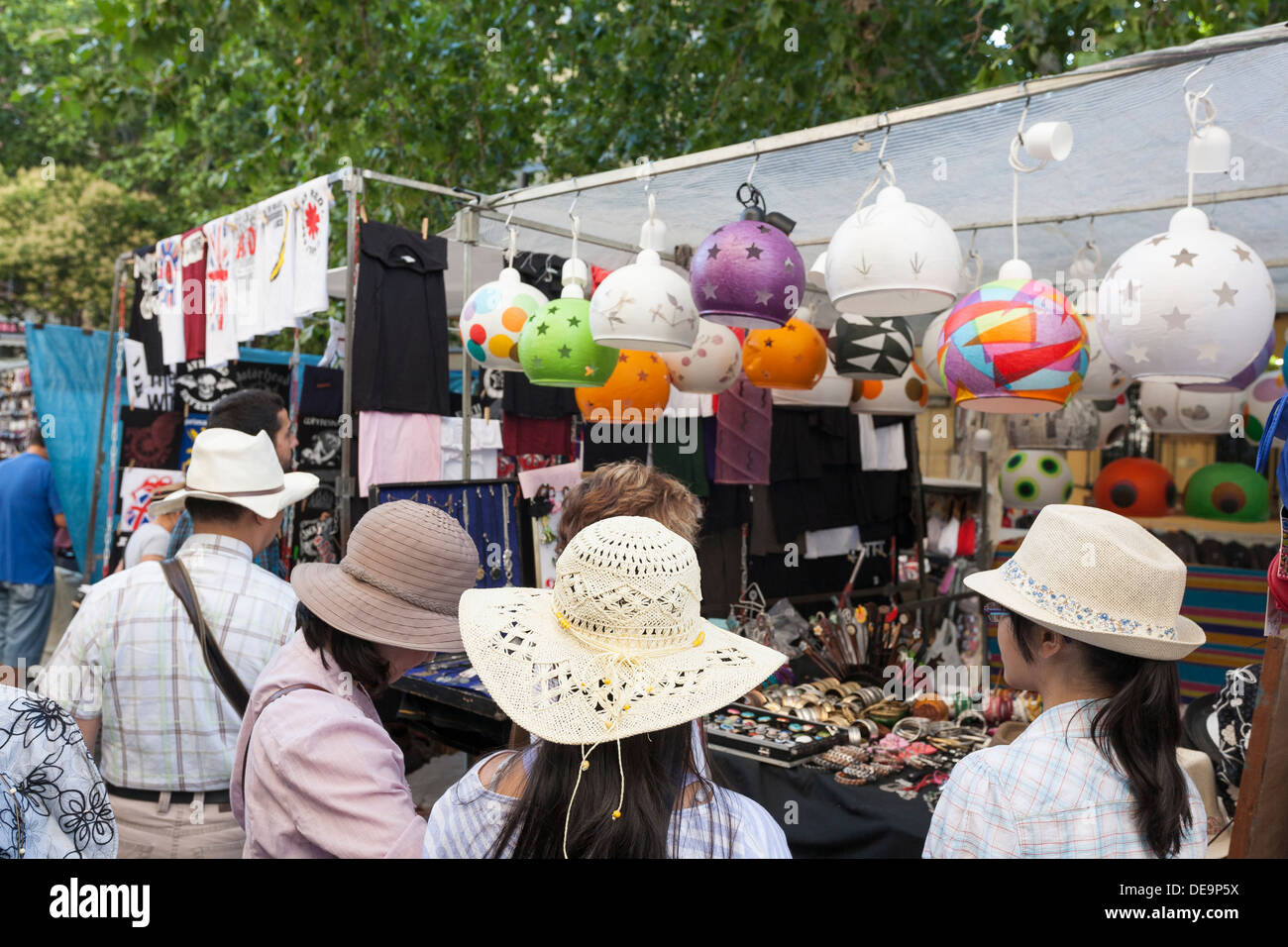 Tourists shopping at El Rastro flea market - Embajadores, Madrid, Spain ...