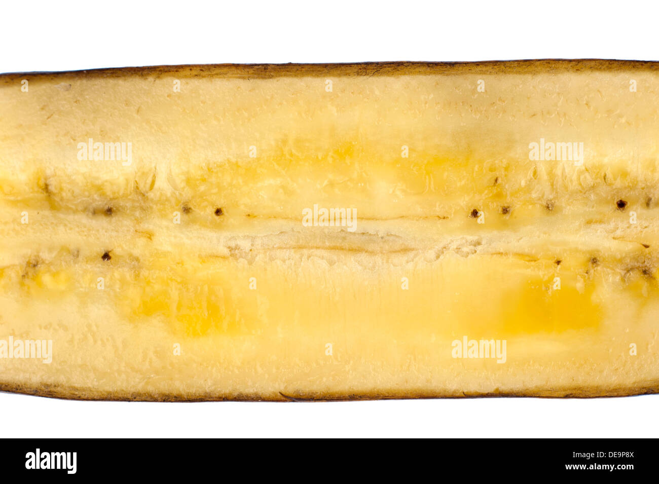 A banana cut through the length and isolated in white Stock Photo - Alamy