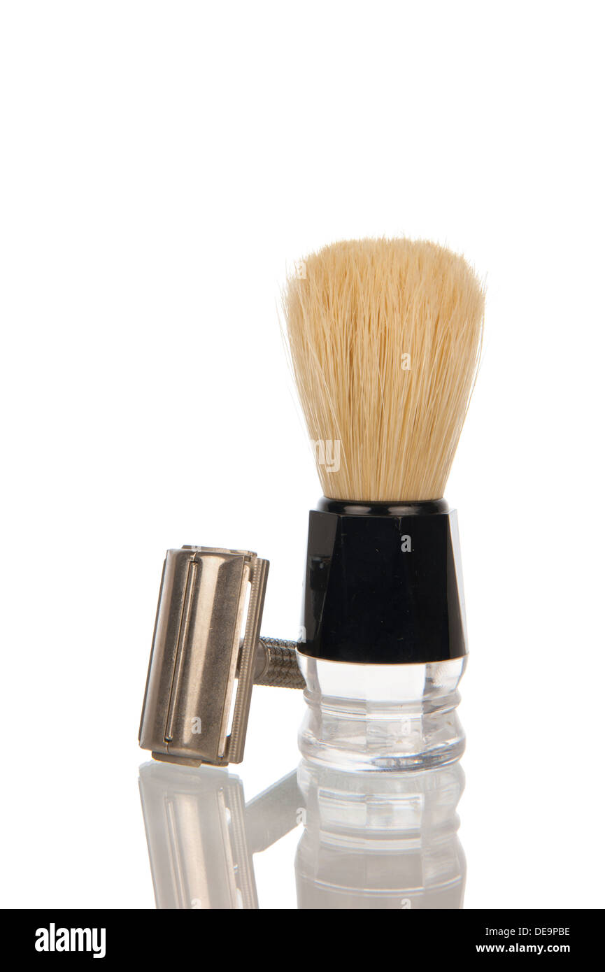 Traditional steel razor with hairy shaving brush isolated in white ...