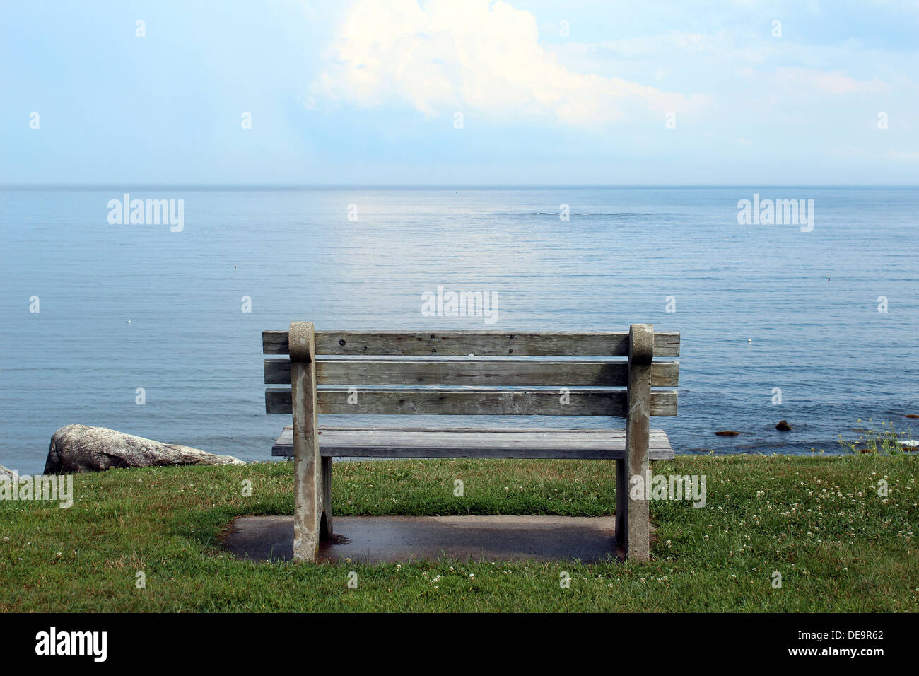 cement and wood bench on a cliff overlooking a calm sea Stock Photo - Alamy