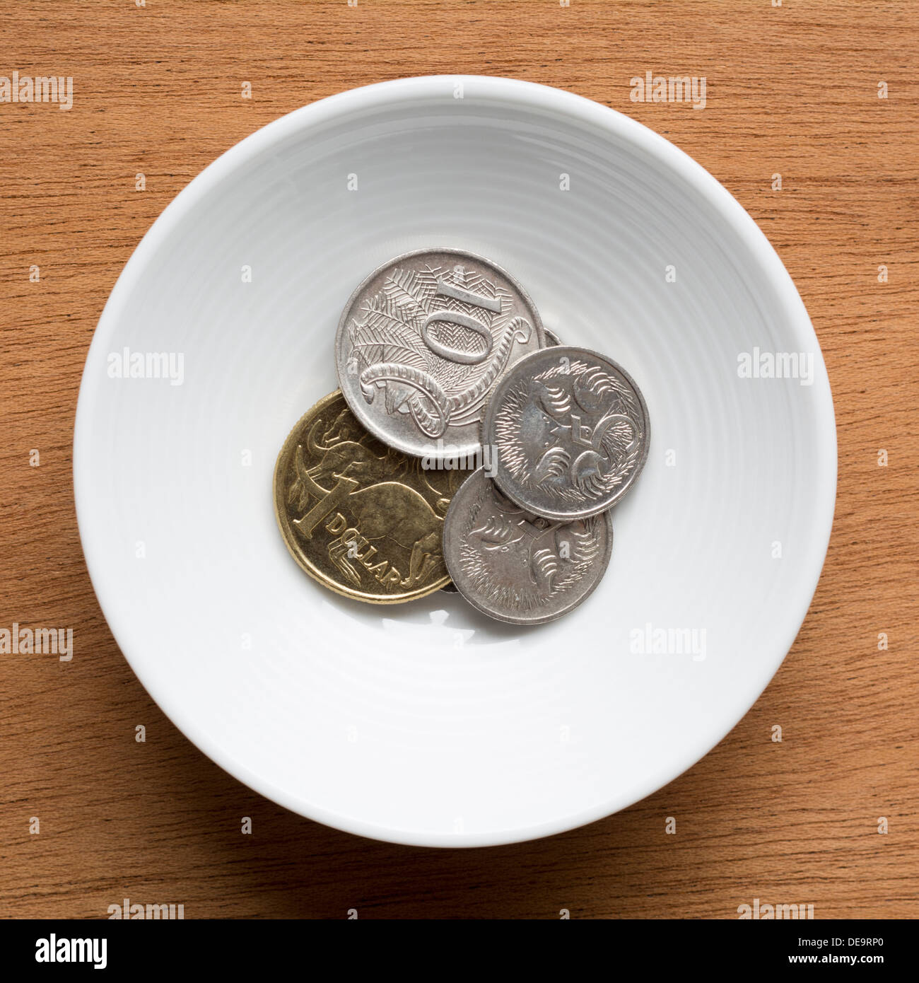 Bowl filled with Australian coins Stock Photo - Alamy