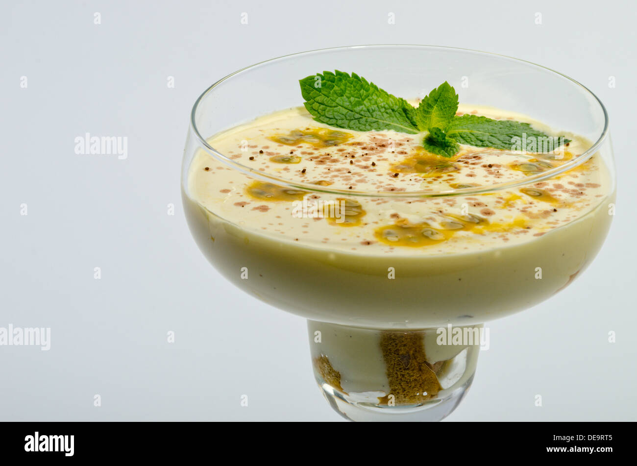 Tiramisu with fruit of passion and peach Stock Photo - Alamy