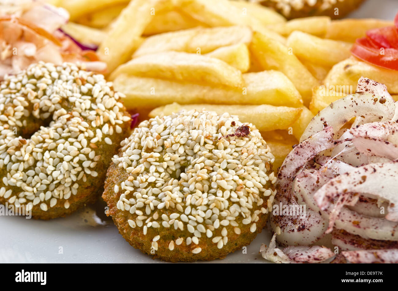 Falafel with french fries and vegetables Stock Photo - Alamy