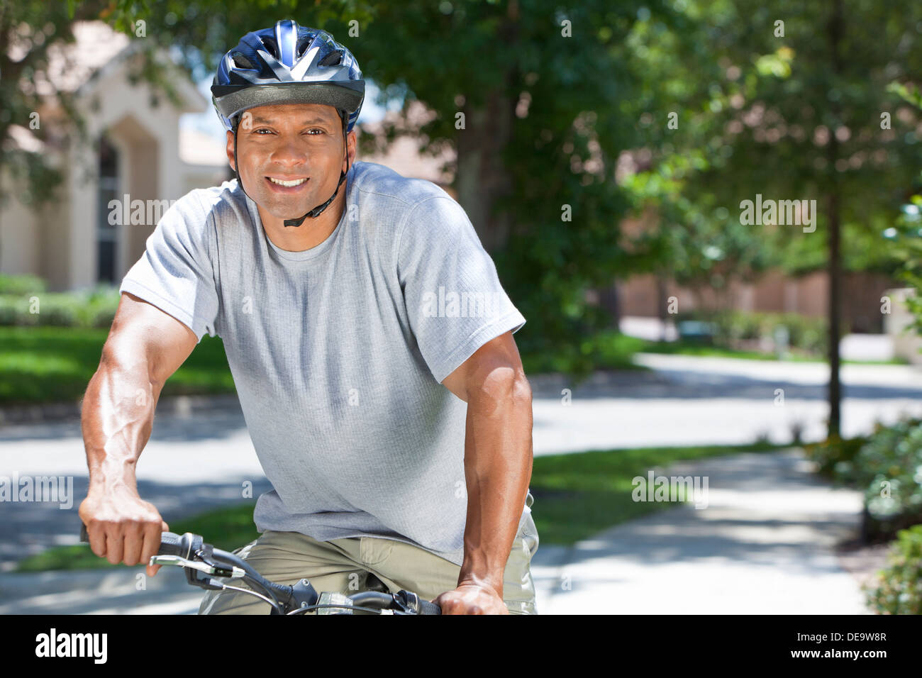 Black man riding a bike hi-res stock photography and images - Alamy