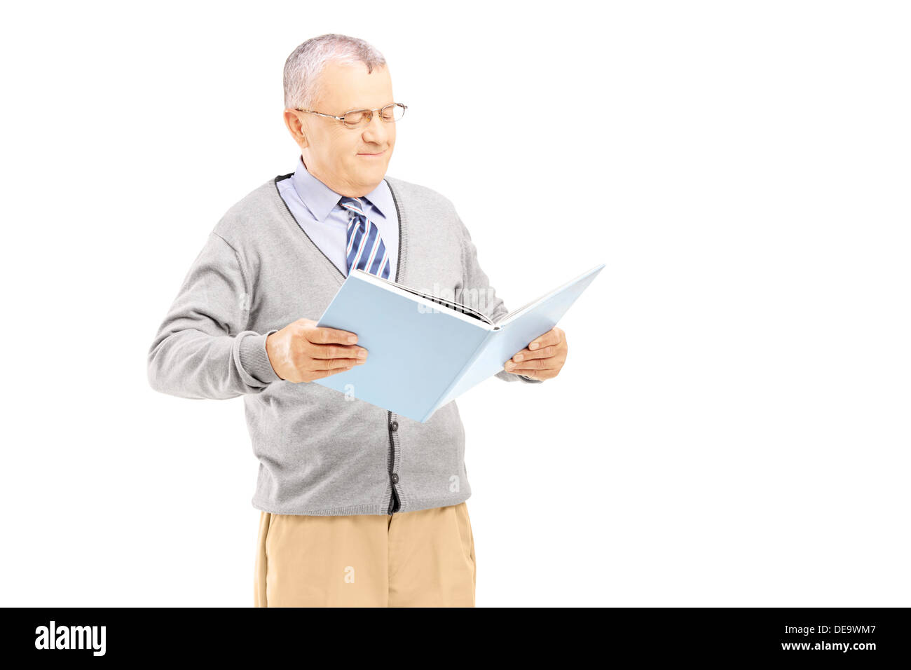 Smiling middle aged gentleman reading a book Stock Photo - Alamy