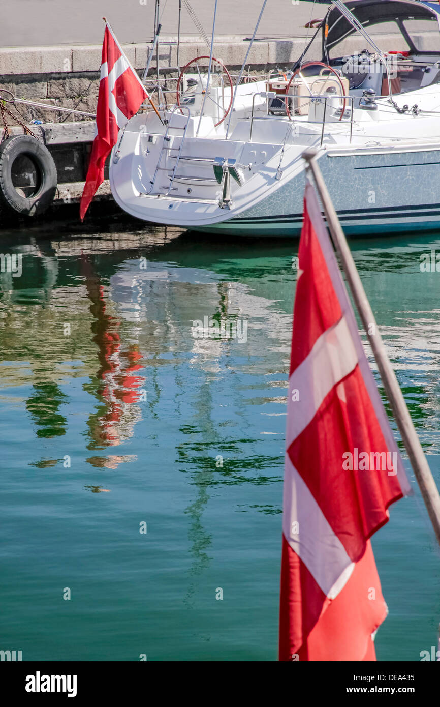 Sailboat with Danish flag in the harbor of Svaneke on Bornholm, Denmark ...