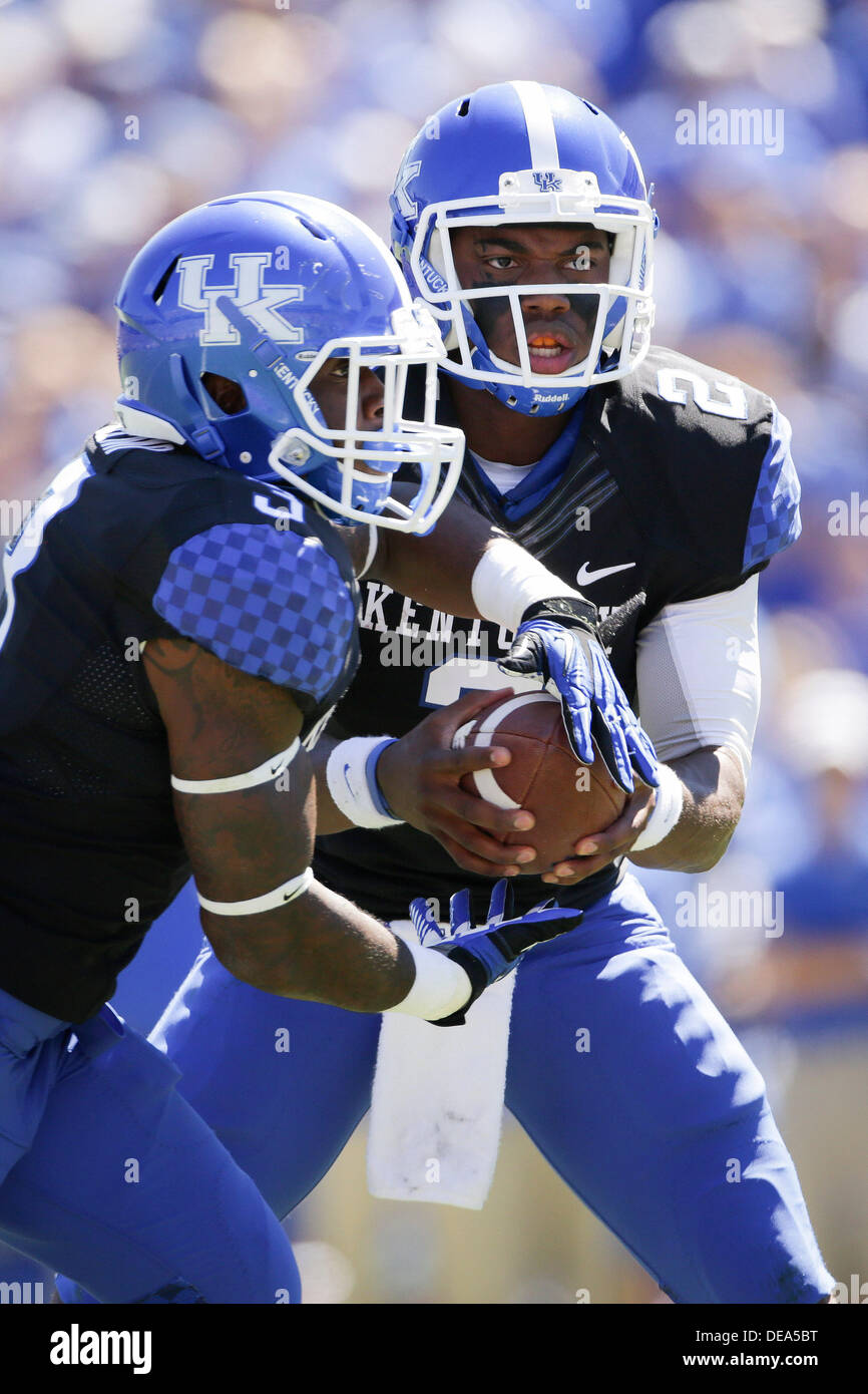 UK quarterback Jalen Whitlow hands off the ball to UK running back Jojo ...