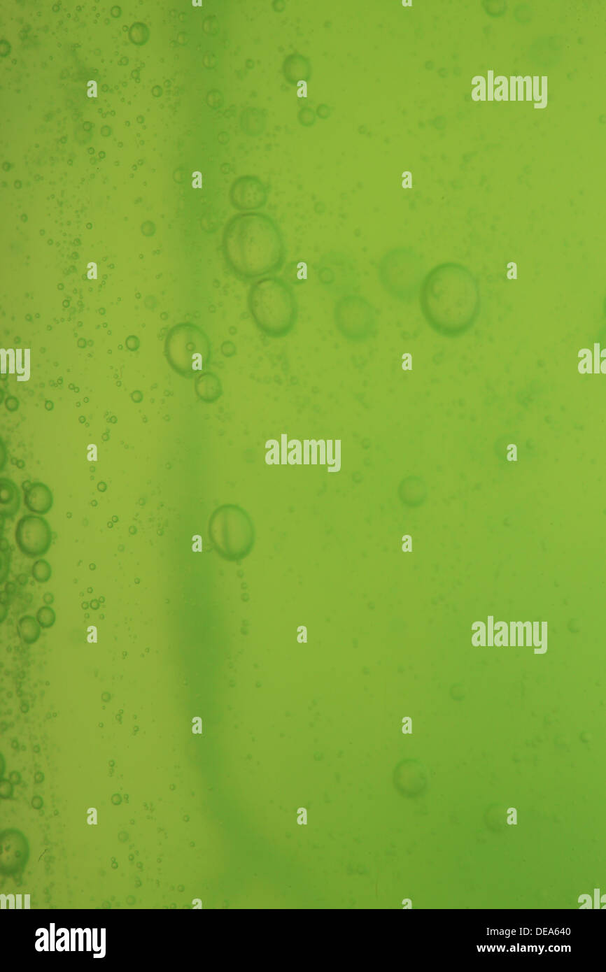 Background or texture of green liquid drop Stock Photo - Alamy