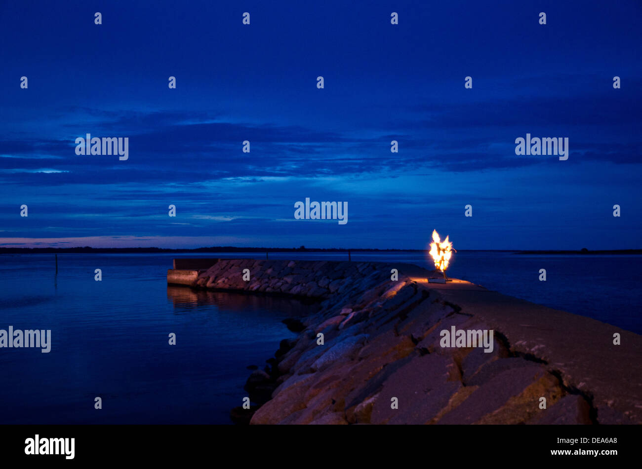 Bonfire at a pier in harbour Stock Photo - Alamy