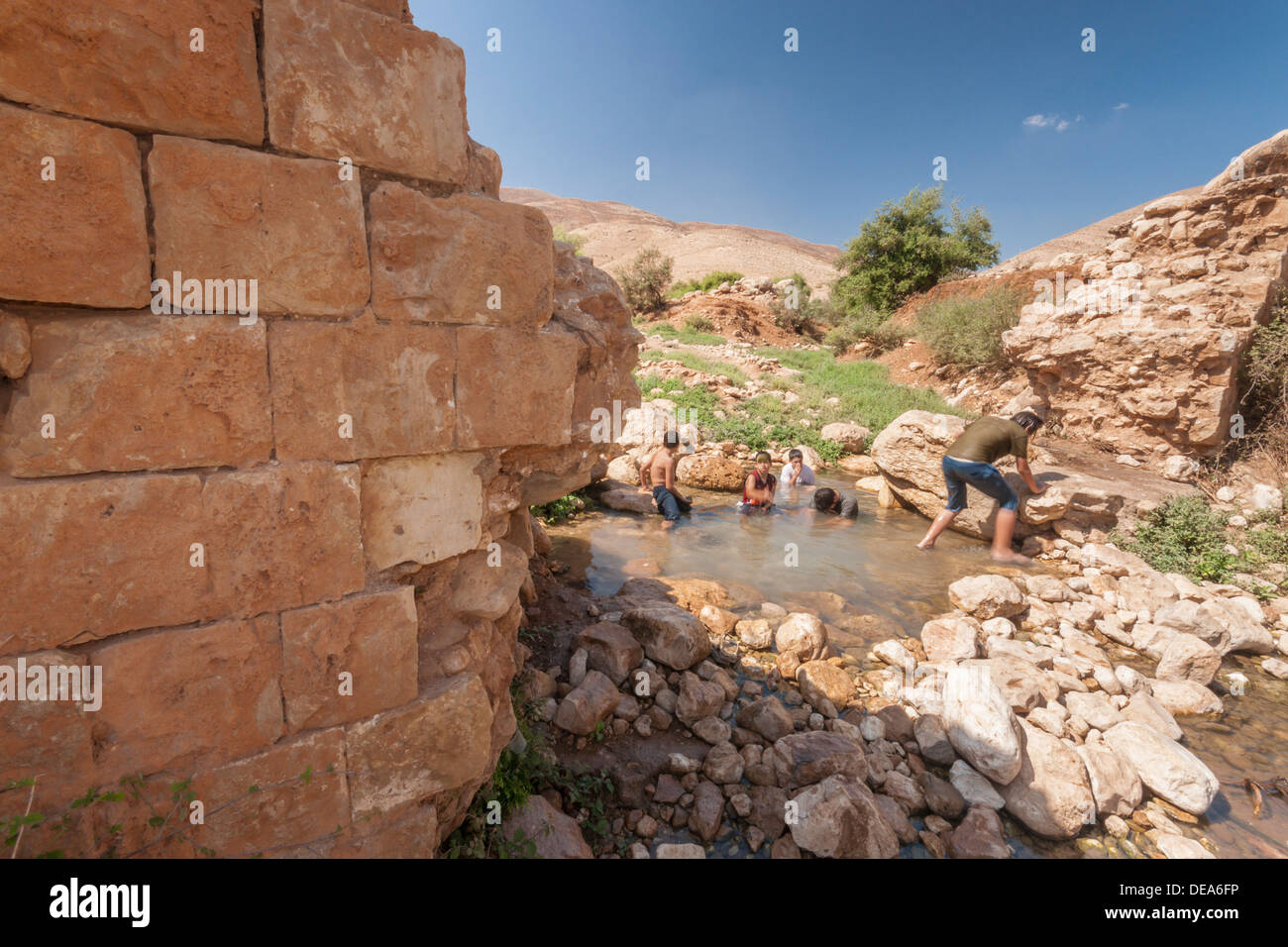 Patzaael Spring, Israel. an oasis in the Judea desert. People take a ...