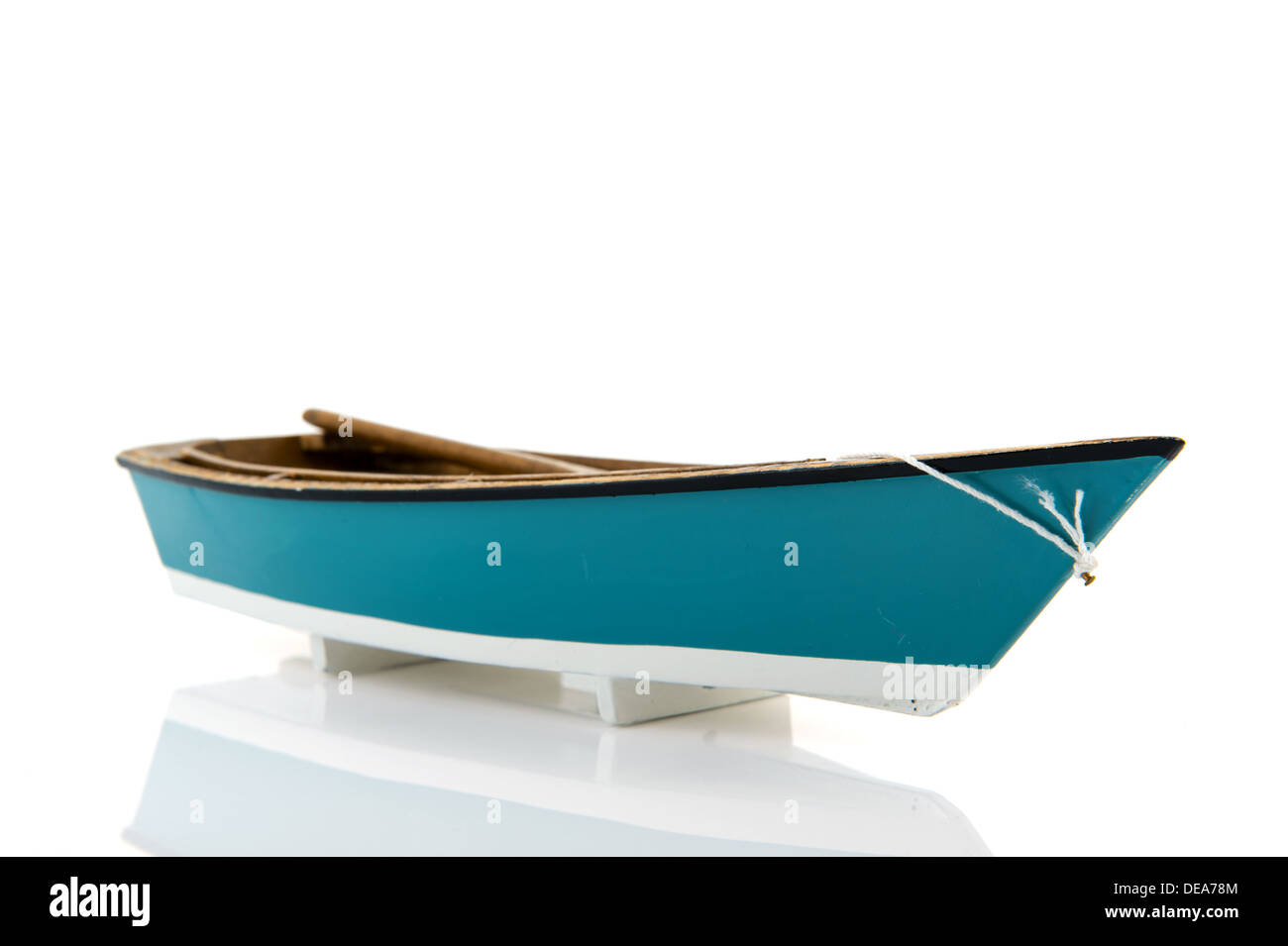 Blue miniature rowing boat isolated over white background Stock Photo ...