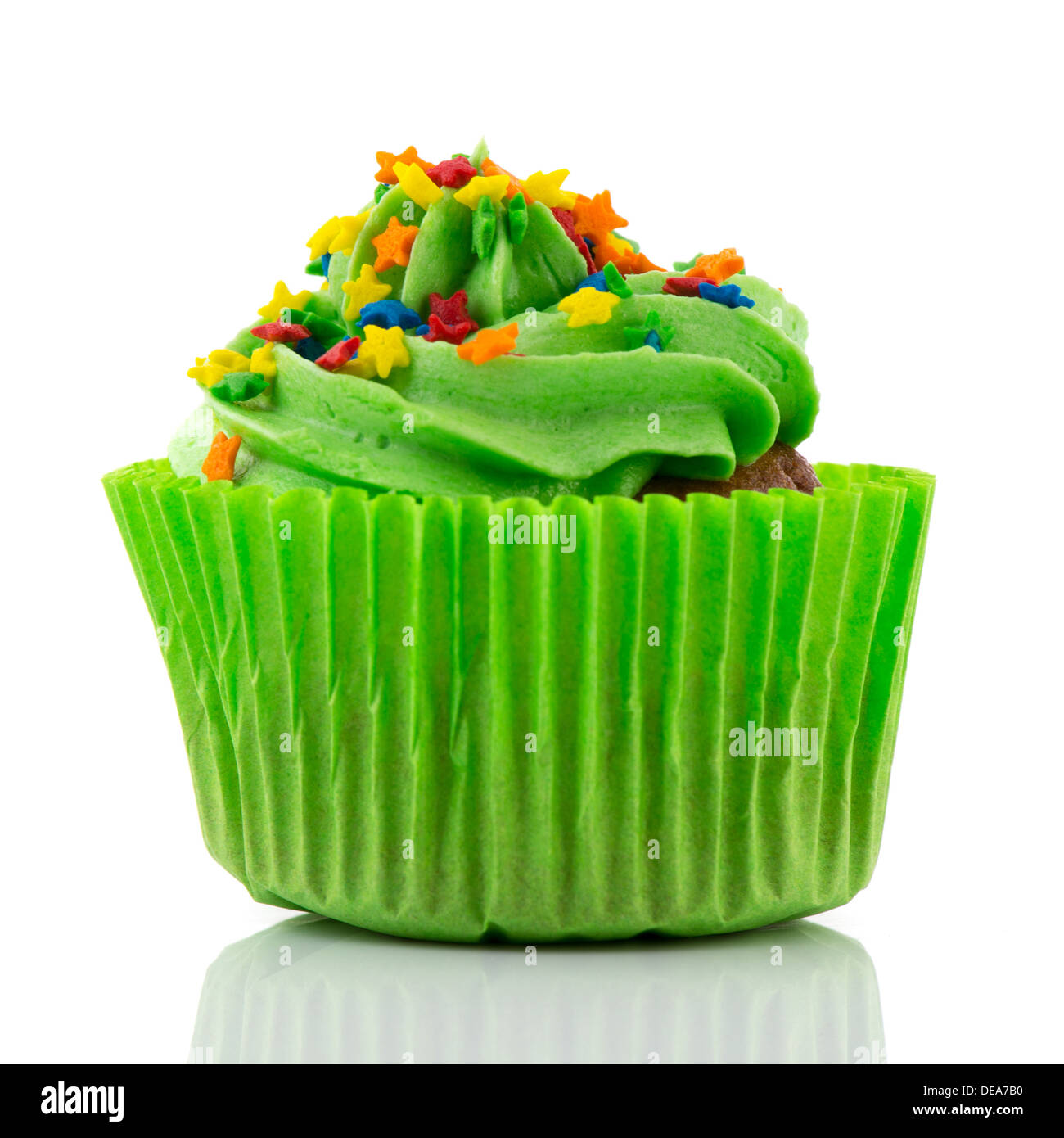 Single green cupcake with confetti stars Stock Photo - Alamy
